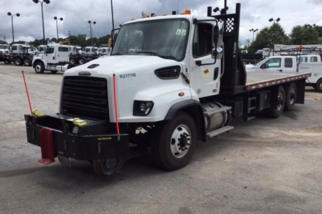 Heavy-Duty Hi-Rail Flatbed Truck Rental - Custom Truck One Source